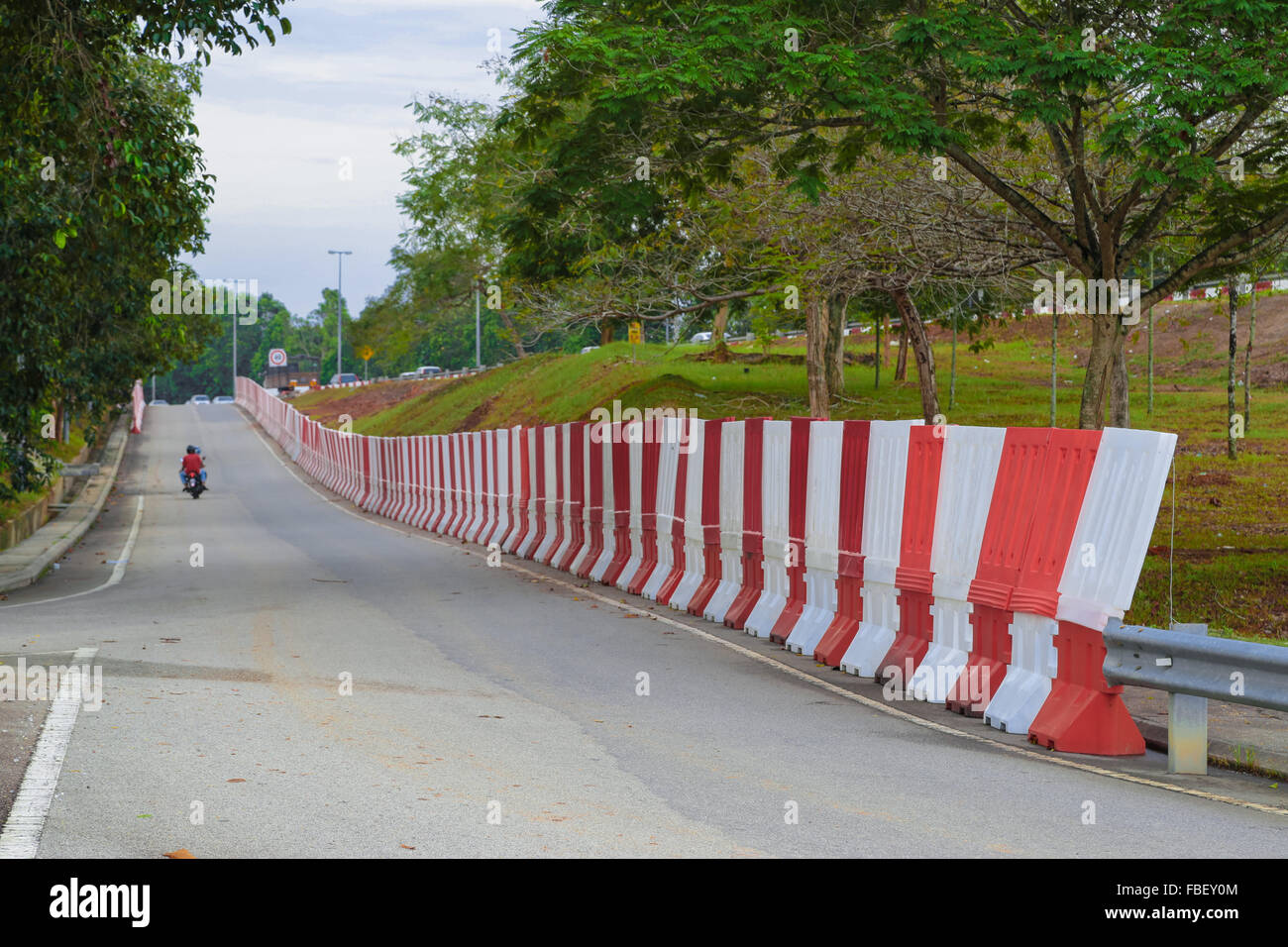 Road barriers erected along the work in progress construction area ...