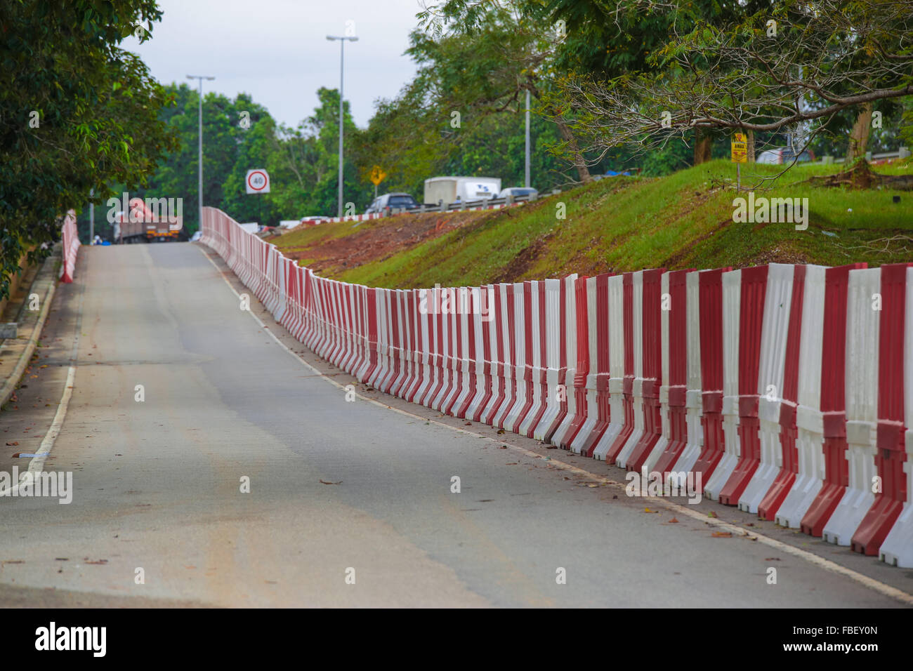 Road barriers erected along the work in progress construction area ...