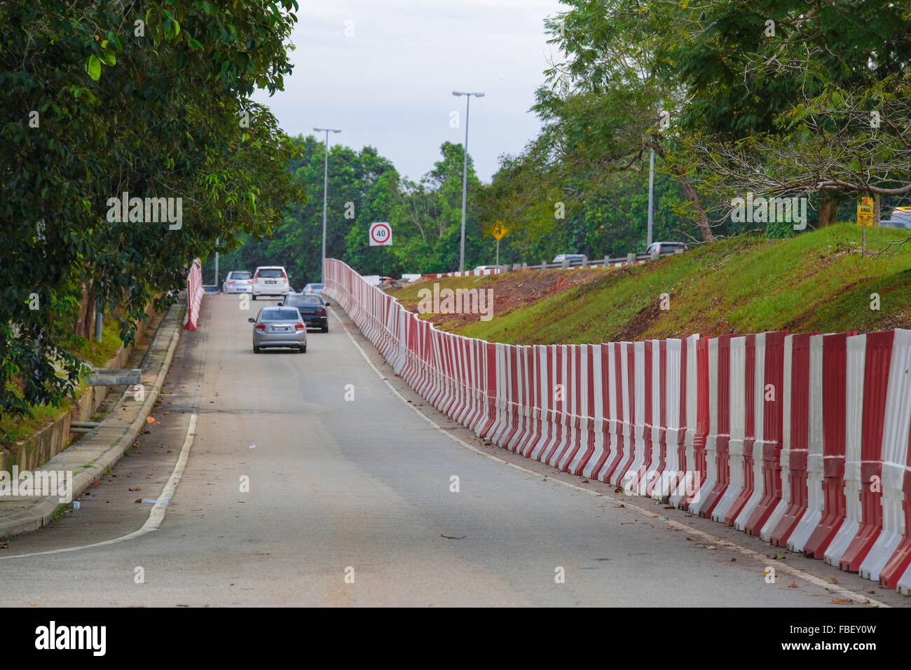 Road barriers erected along the work in progress construction area ...