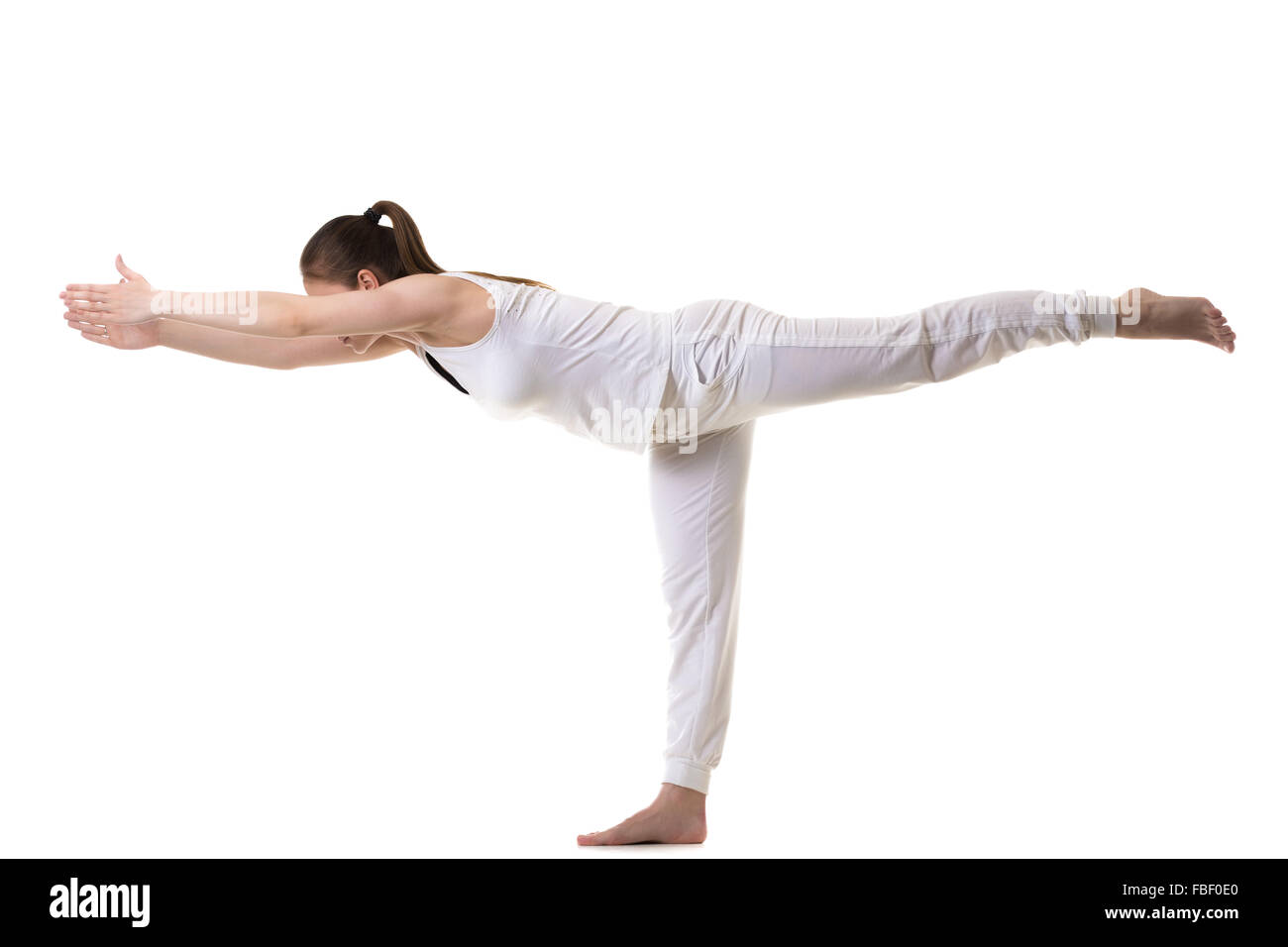 Beautiful fitness model practices yoga or pilates, doing exercise for ...