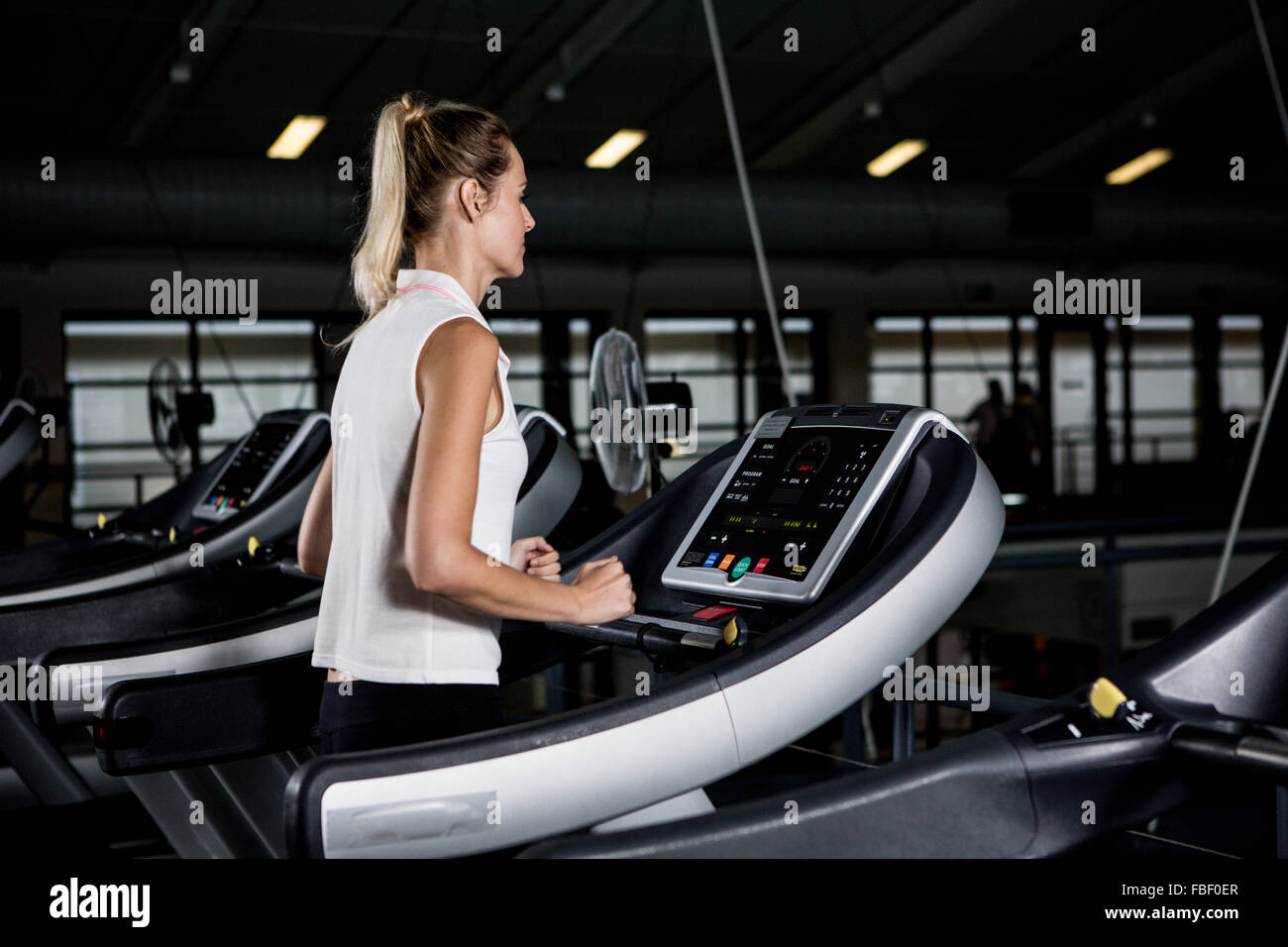 Attractive blonde woman running on hi-res stock photography and images ...