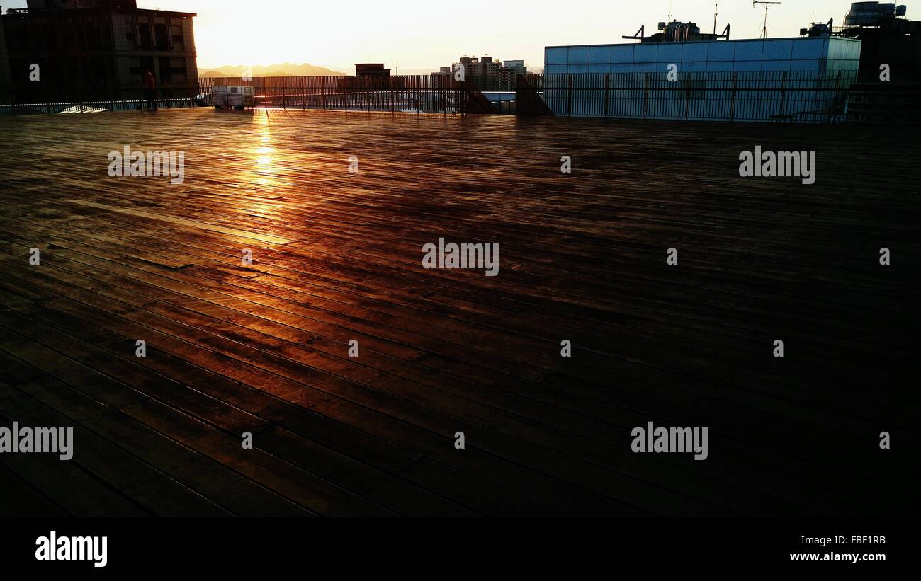 Wooden Terrace Of Building During Sunset Stock Photo - Alamy