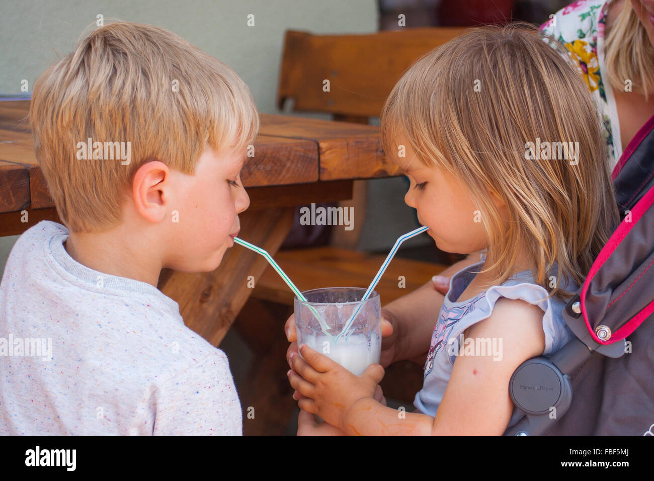 Boy girl sharing milkshake hi-res stock photography and images - Alamy