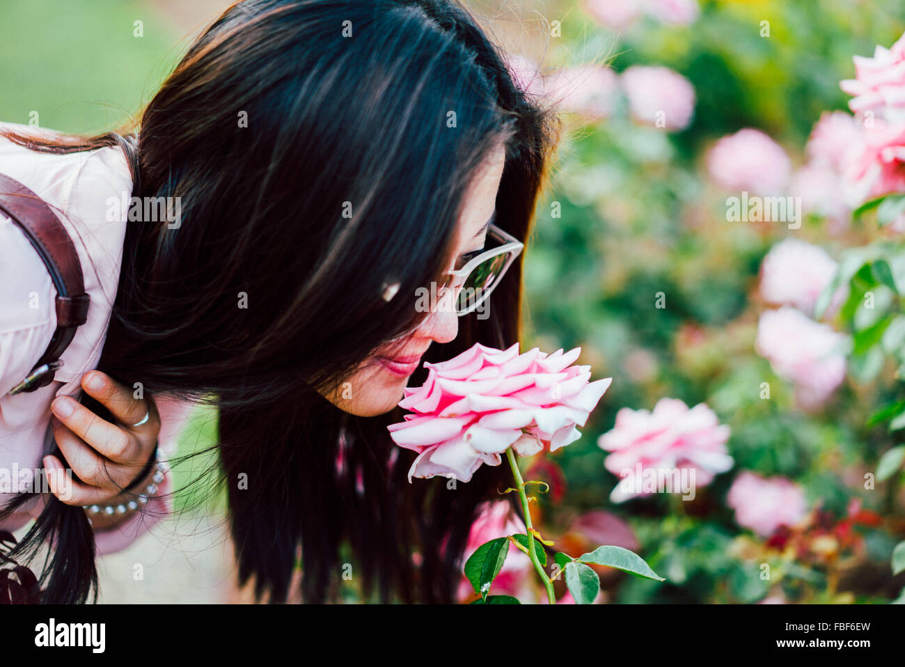 Asian woman smelling flower hi-res stock photography and images - Alamy