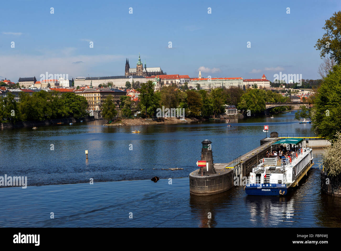 A boat passing through Vltava river navigation chamber, Prague Castle ...