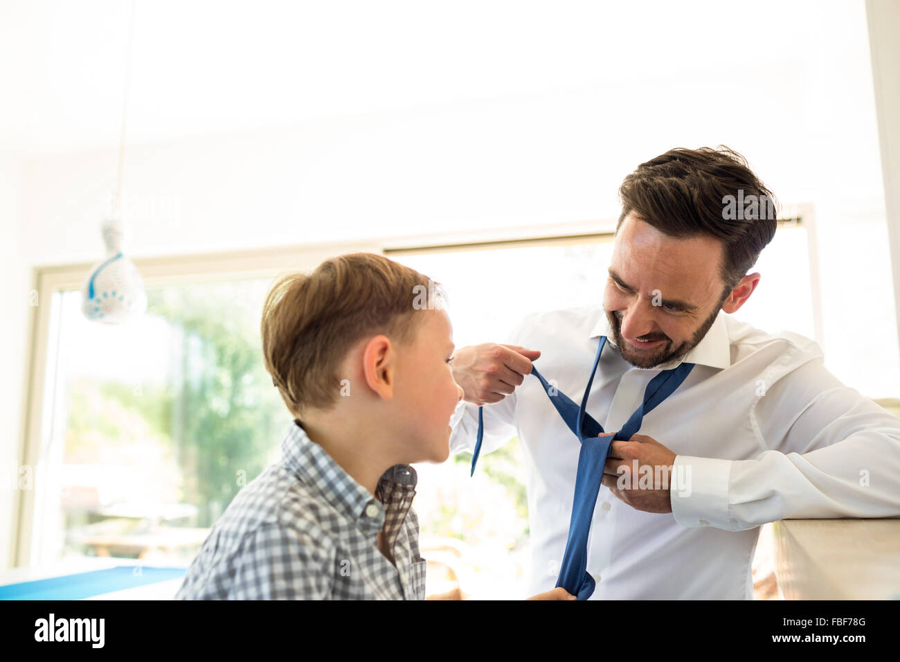 Father and son getting ready Stock Photo - Alamy
