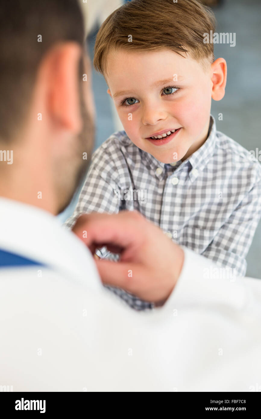 Smiling son with father Stock Photo - Alamy