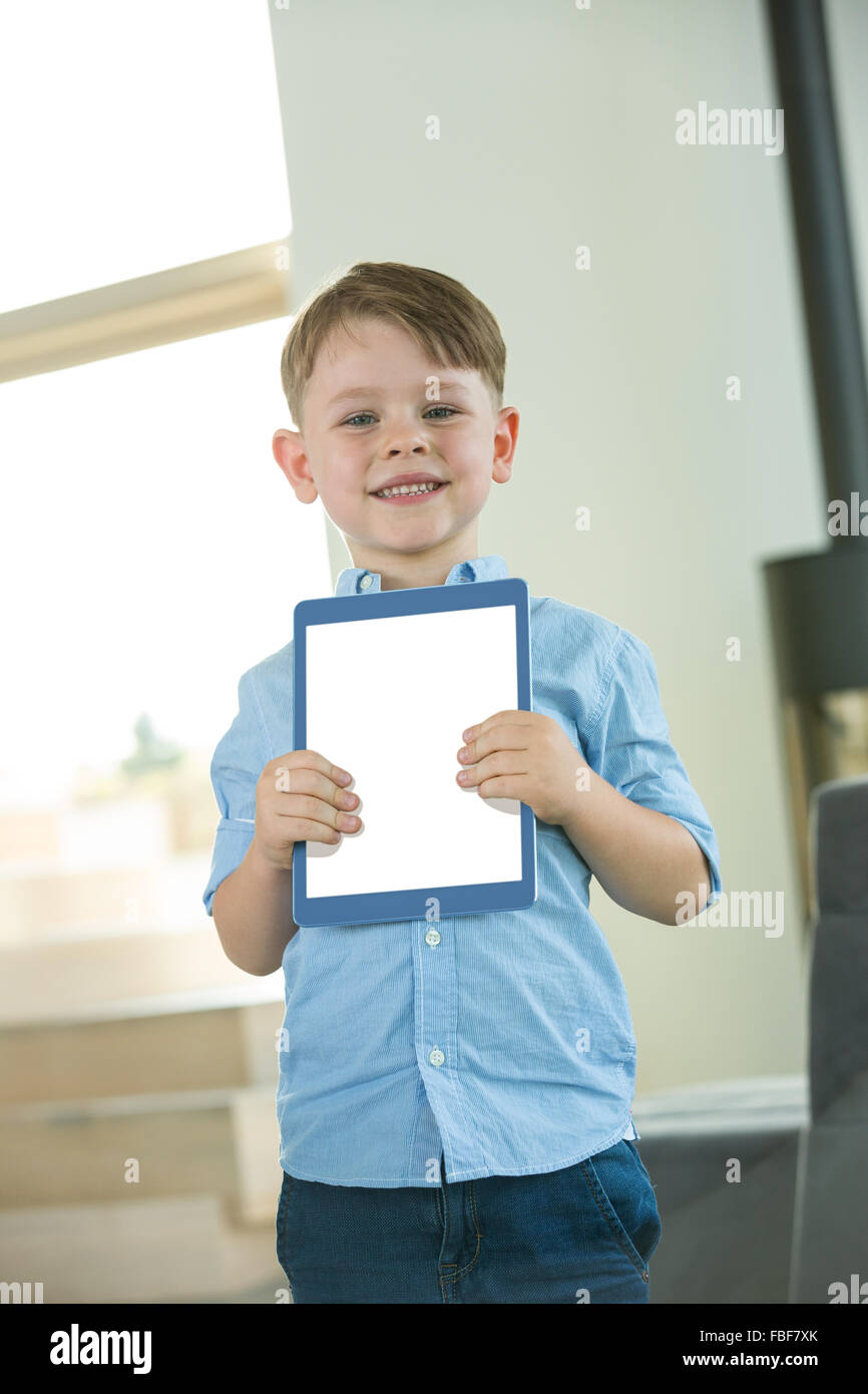 Cute boy holding tablet Stock Photo - Alamy