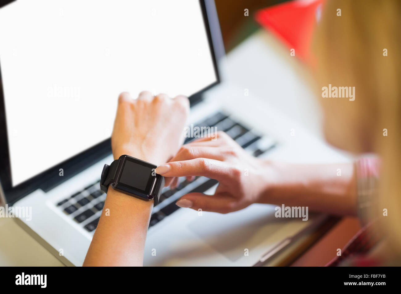 Female student using smart watch Stock Photo - Alamy