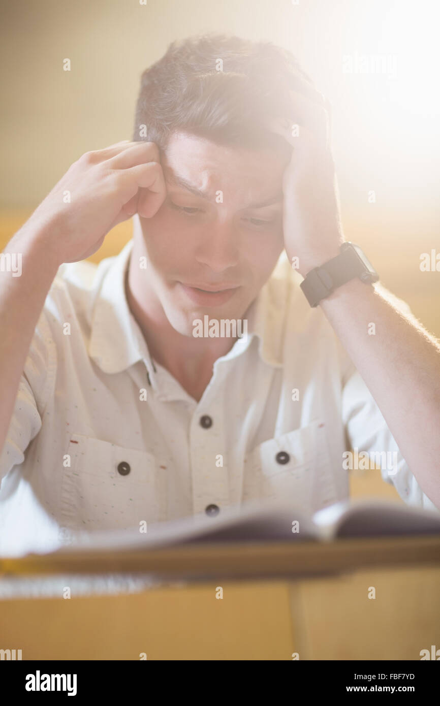 Concentrated male student during class Stock Photo - Alamy