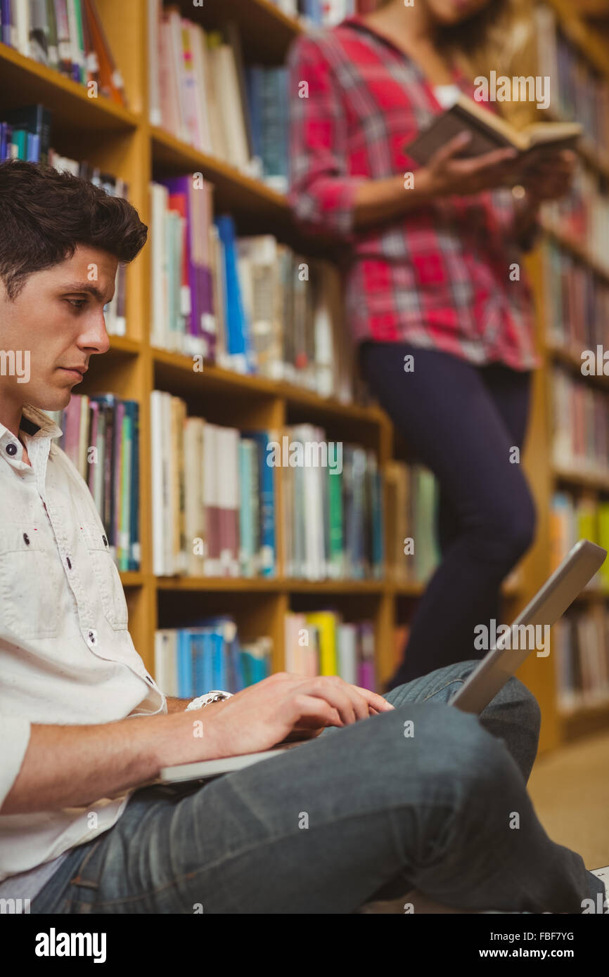 Male student working on floor Stock Photo - Alamy