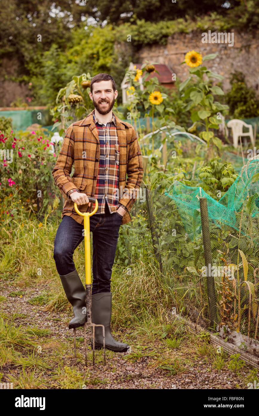 Smiling man with a shovel Stock Photo - Alamy