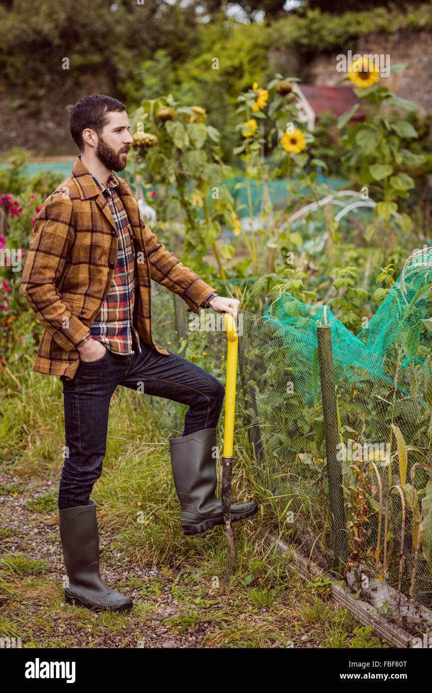 Man posing with his shovel Stock Photo - Alamy