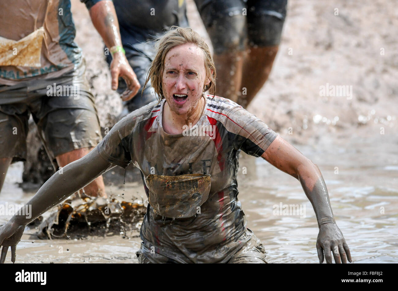Female runner at obstacle course race, UK Stock Photo - Alamy