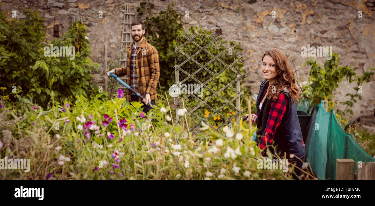 Young couple gardens together Stock Photo - Alamy