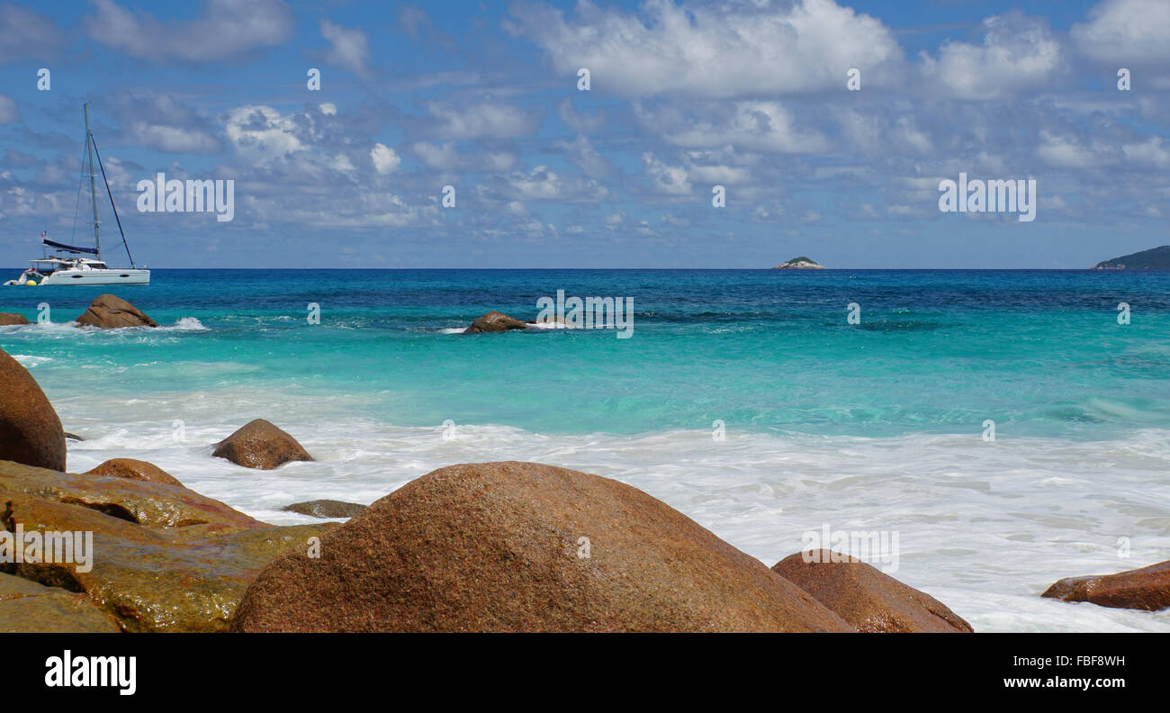 granite rocks and catamaran on seychelles Stock Photo - Alamy