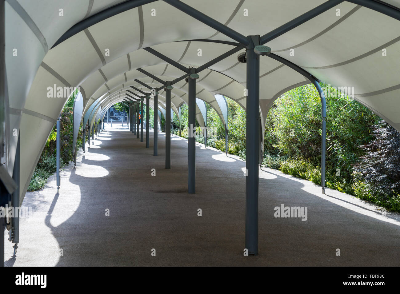Pedestration covered walkway to the O2 centre Stock Photo - Alamy