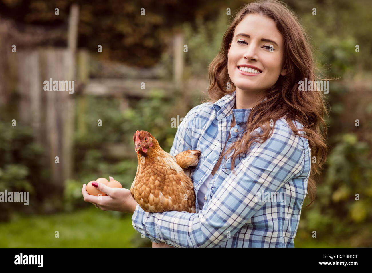 Woman holding and chicken and egg Stock Photo - Alamy