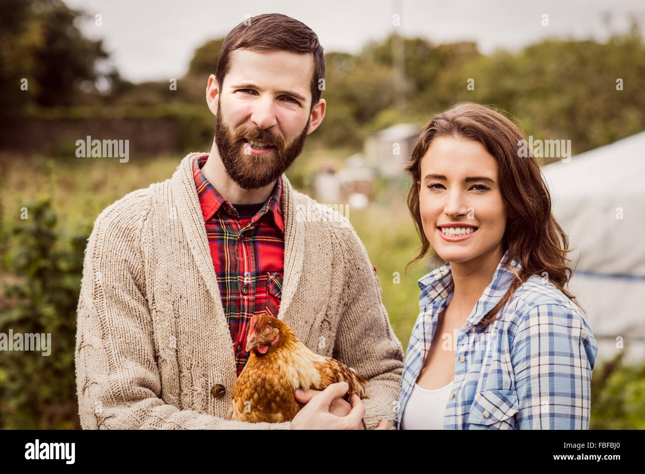 Man holding a chicken hi-res stock photography and images - Alamy