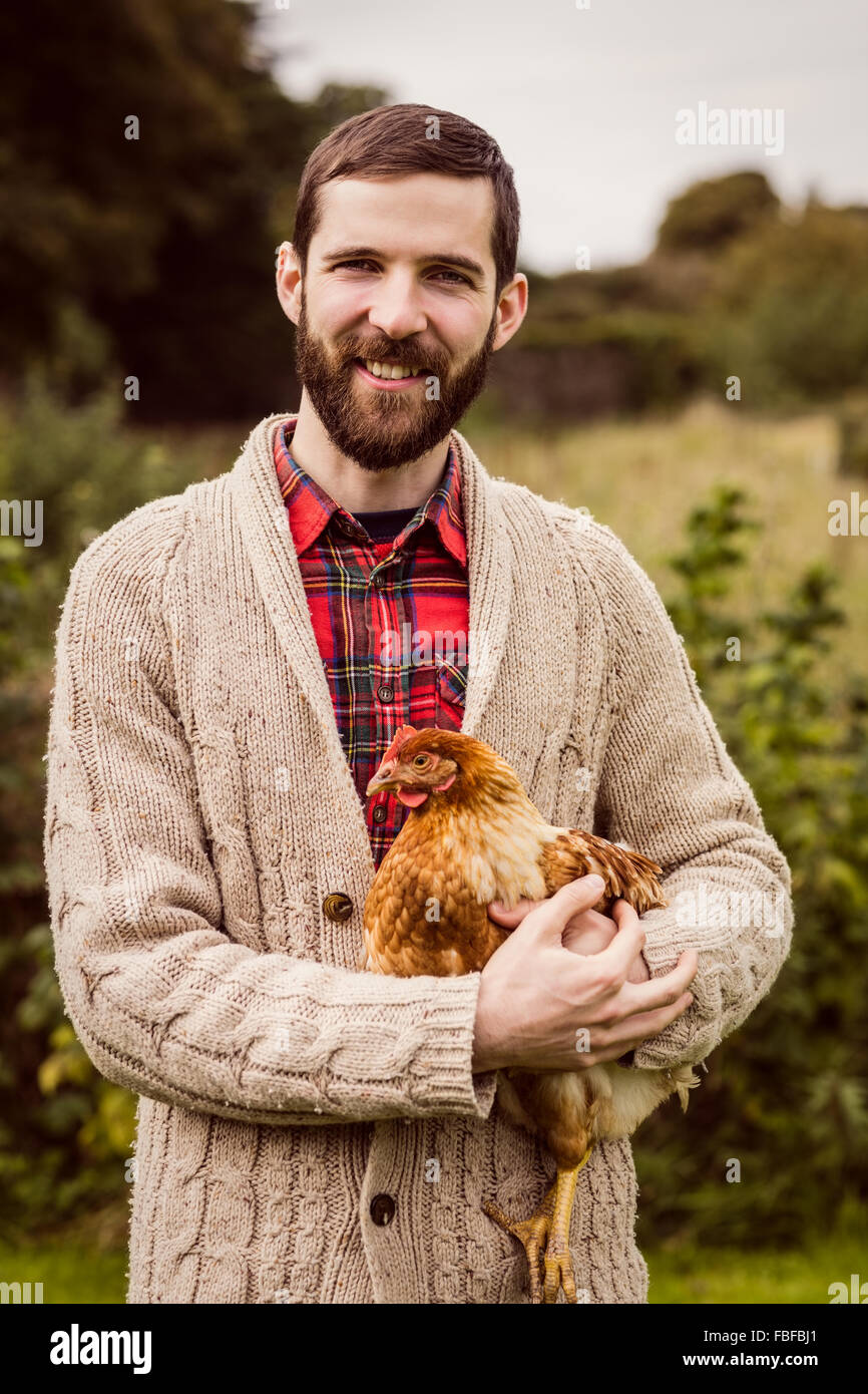 Man holding chicken hi-res stock photography and images - Alamy