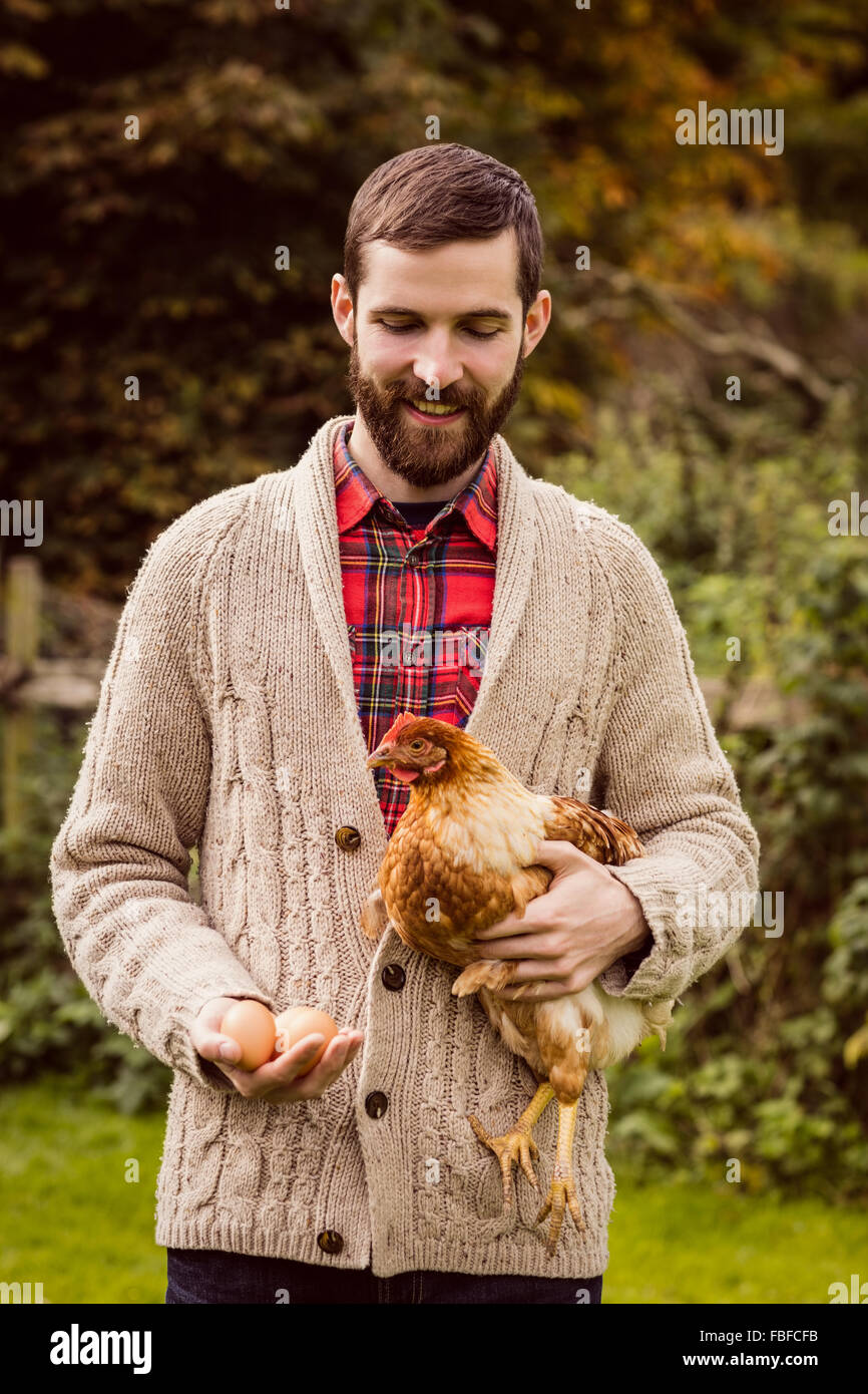 Man holding chicken and egg Stock Photo - Alamy