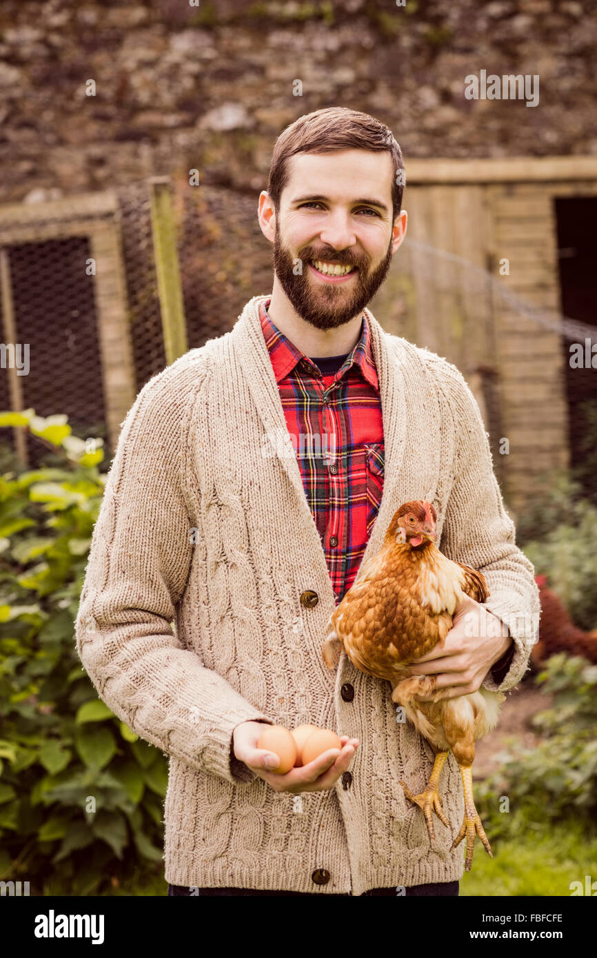 Man holding chicken and egg Stock Photo - Alamy