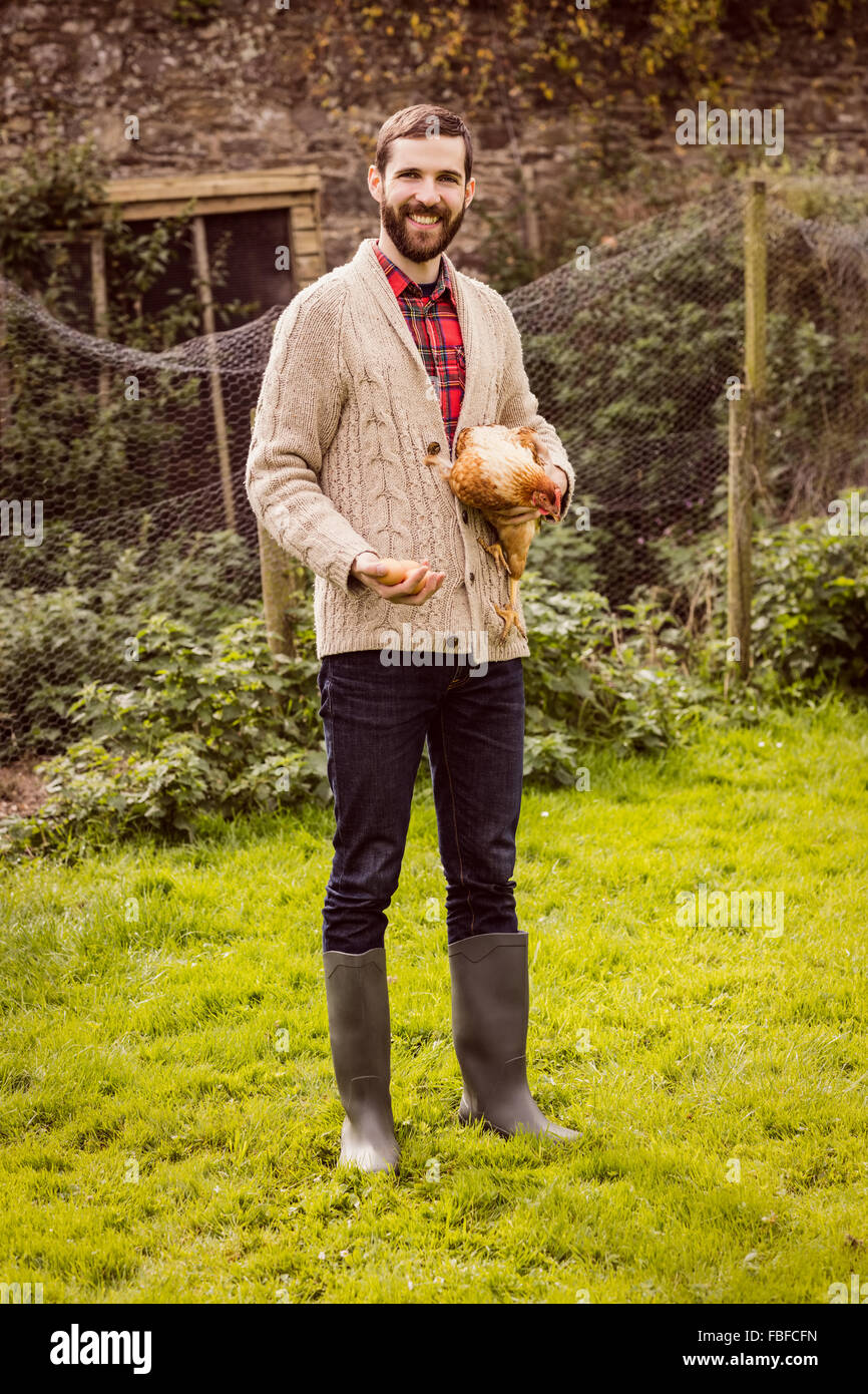 Man holding chicken and egg Stock Photo - Alamy