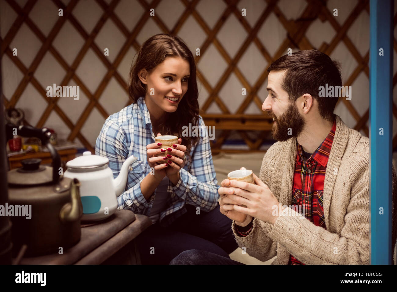 Couple talking and drinking tea Stock Photo - Alamy