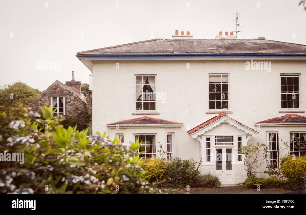 Big white house with garden Stock Photo - Alamy