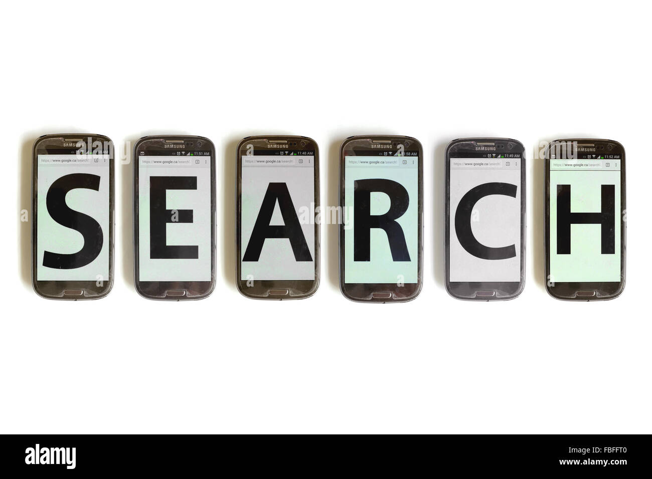Search written on the screens of smartphones photographed against a ...