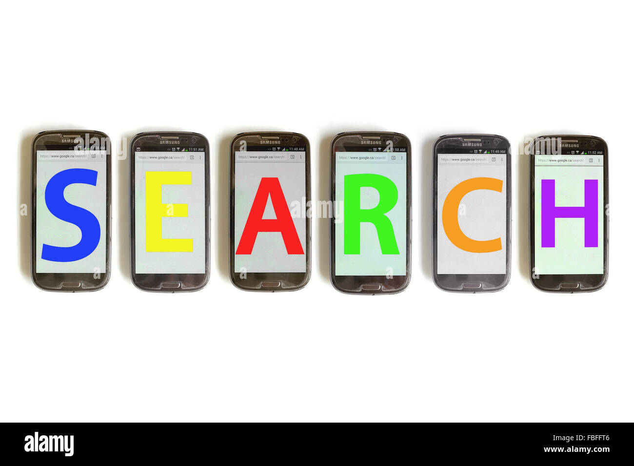 Search written on the screens of smartphones photographed against a ...