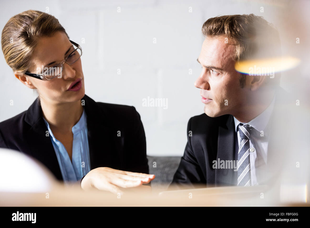 Colleagues talking together Stock Photo - Alamy
