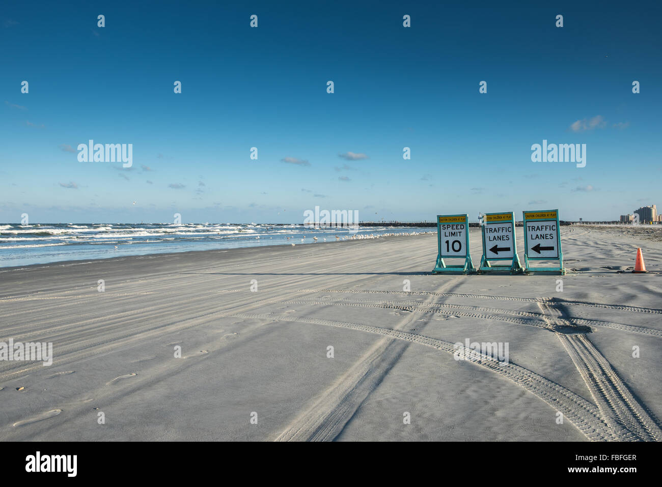 10 mph Speed Limit and Traffic Lane signs pointing left towards the ...