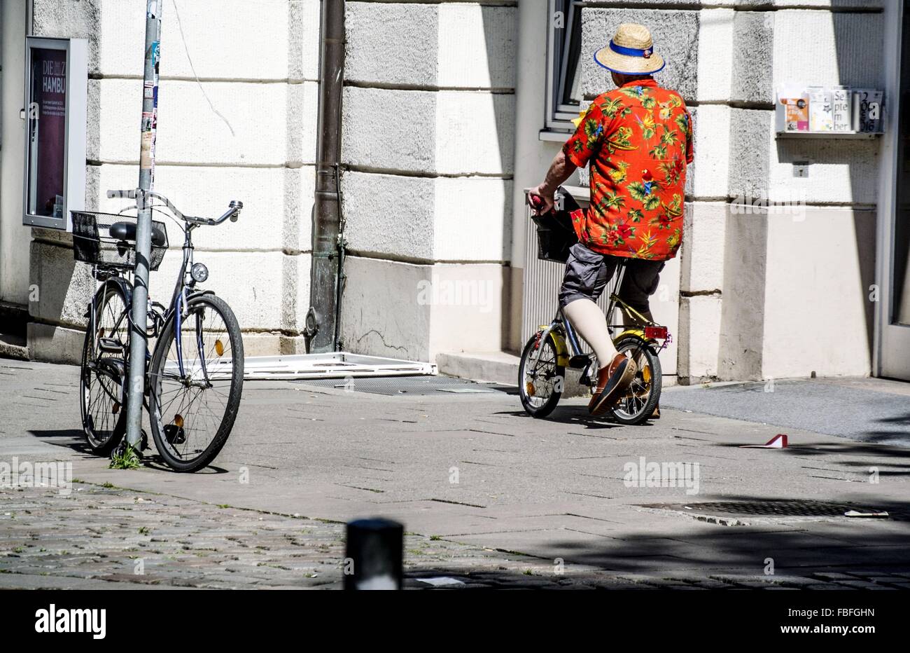 Riding her bicycle hi-res stock photography and images - Alamy