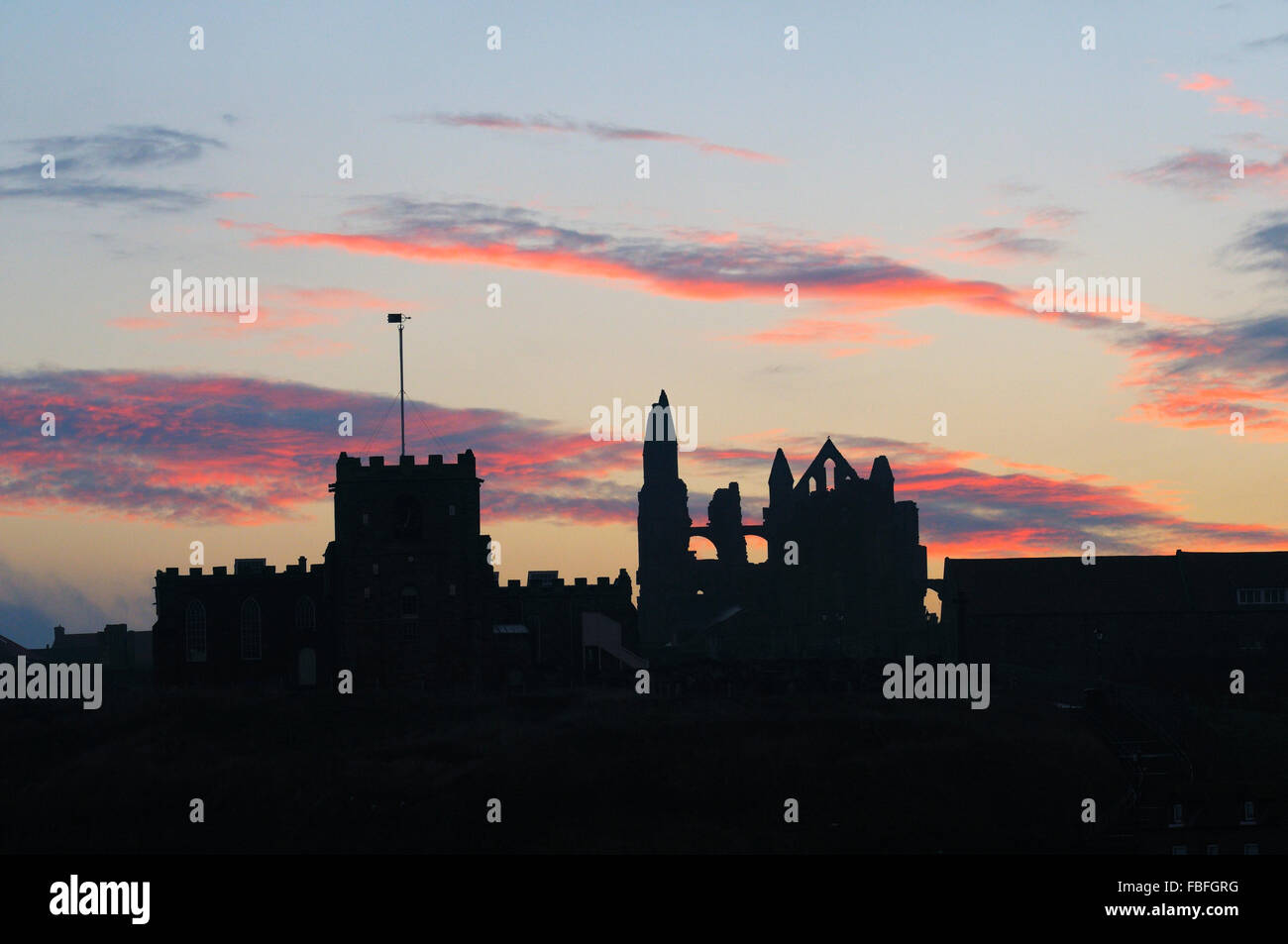 Whitby Abbey and St Mary's Church in silhouette, Whitby, North ...