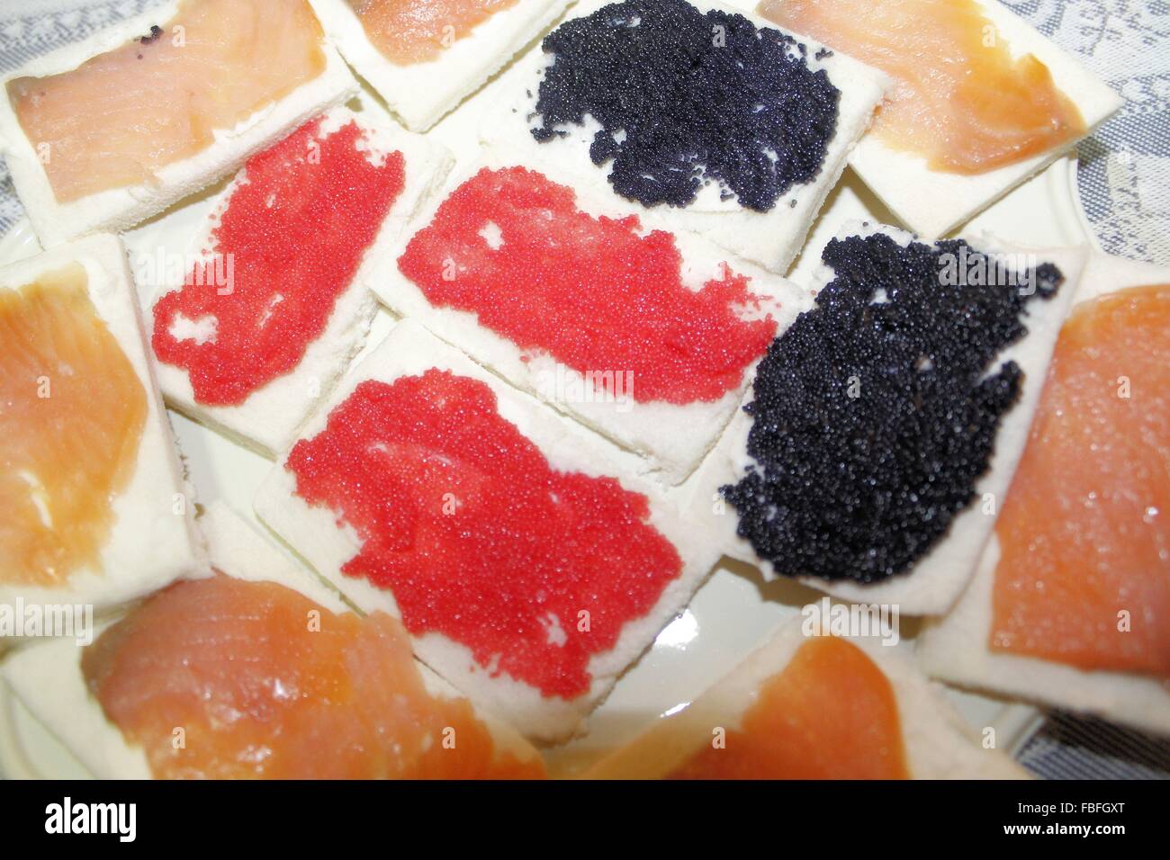 canape with red and black fish caviar and salmon Stock Photo - Alamy