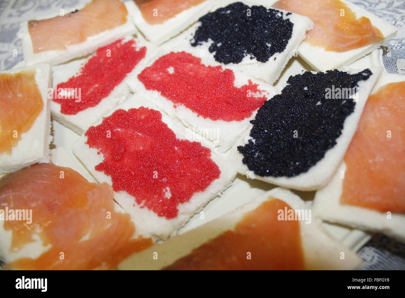 canape with red and black fish caviar and salmon Stock Photo - Alamy
