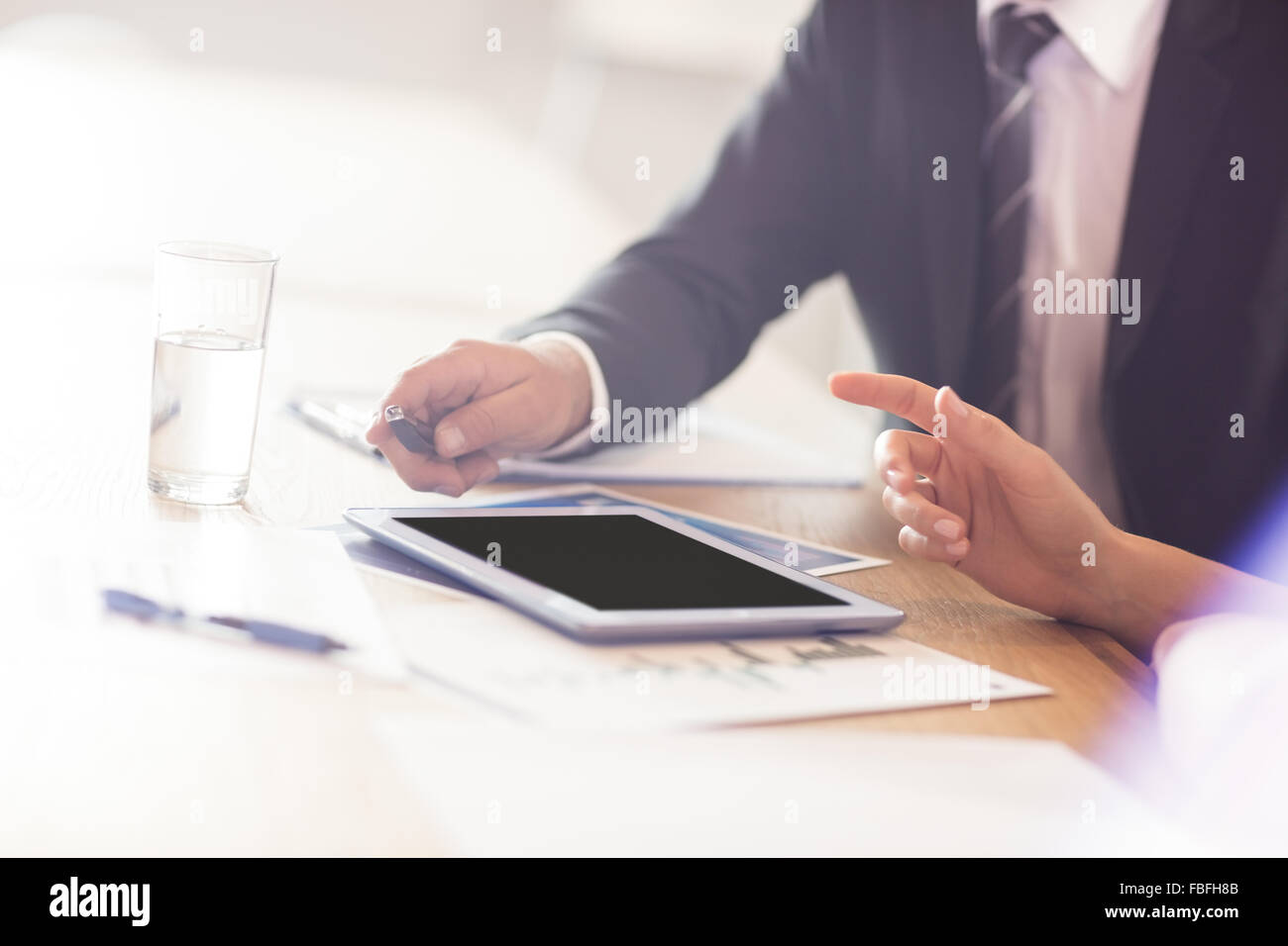 Business people using tablet Stock Photo - Alamy
