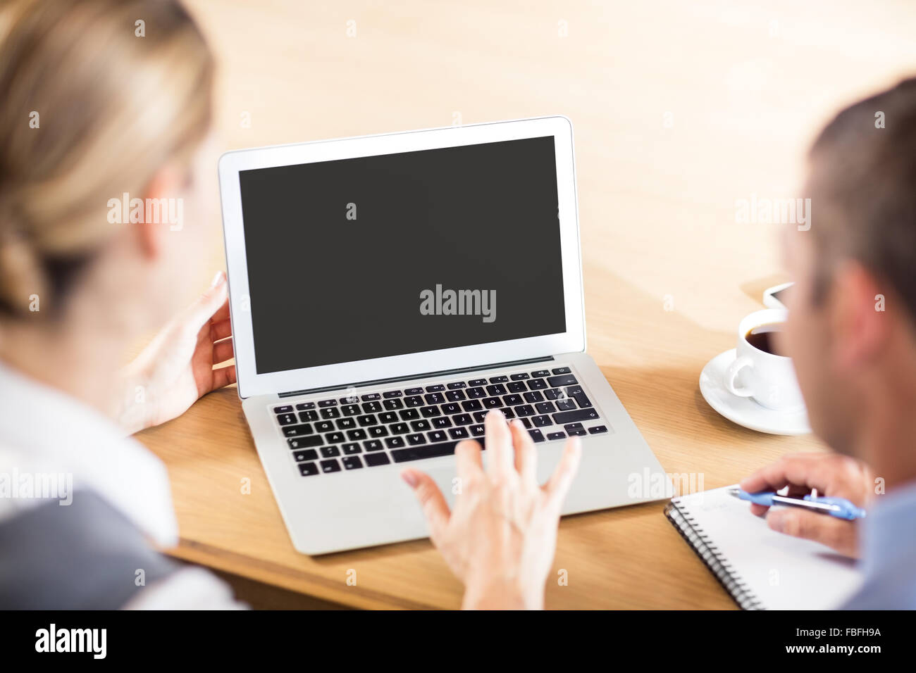 Business people working together while using laptop Stock Photo - Alamy