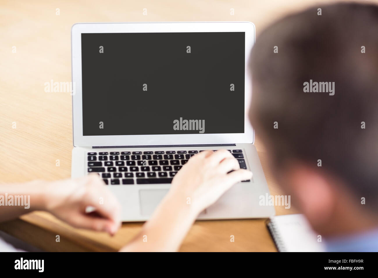 Business people working together while using laptop Stock Photo - Alamy