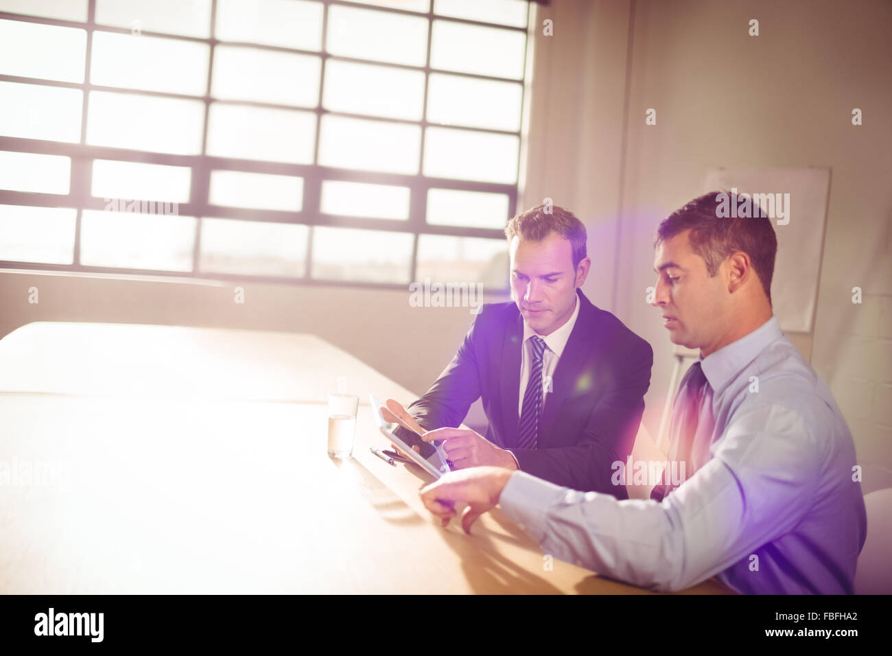 Focused business people working together Stock Photo - Alamy