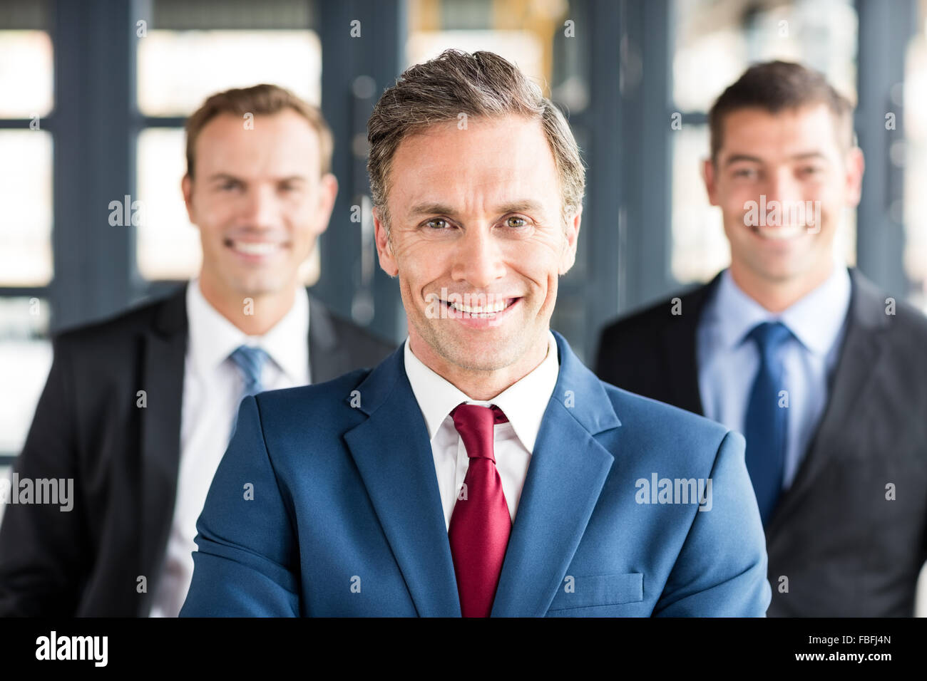 Portrait of smiling business people Stock Photo - Alamy