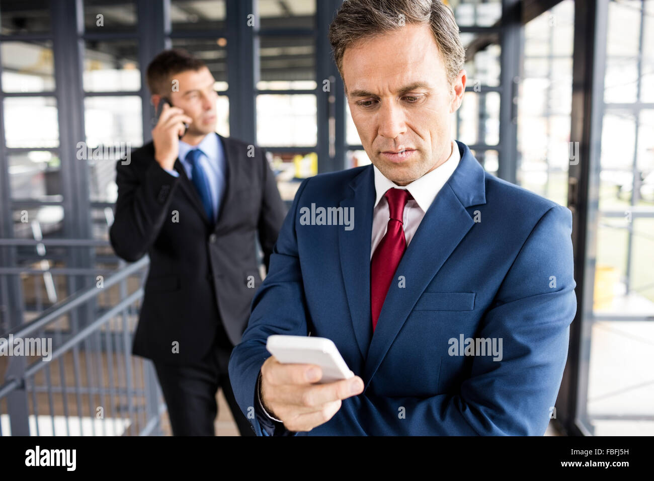 Business people having phone calls Stock Photo - Alamy