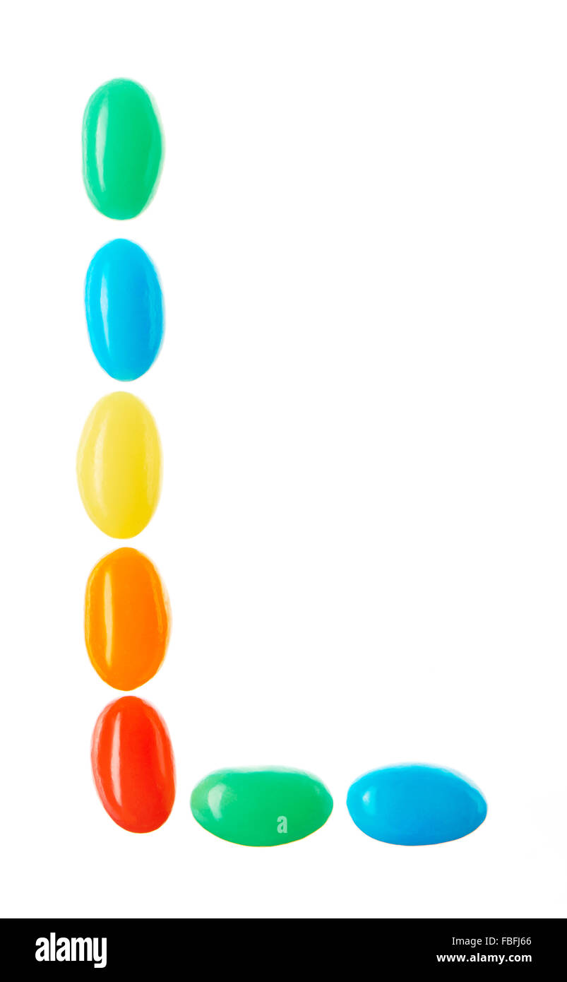 L letter made of multicolored candies isolated on white background ...