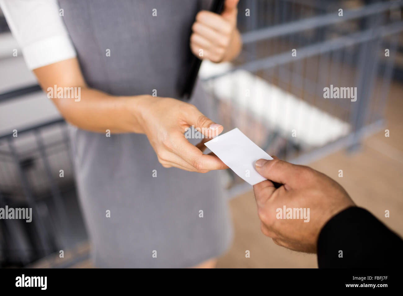 Businessman giving his business card to his colleague Stock Photo - Alamy