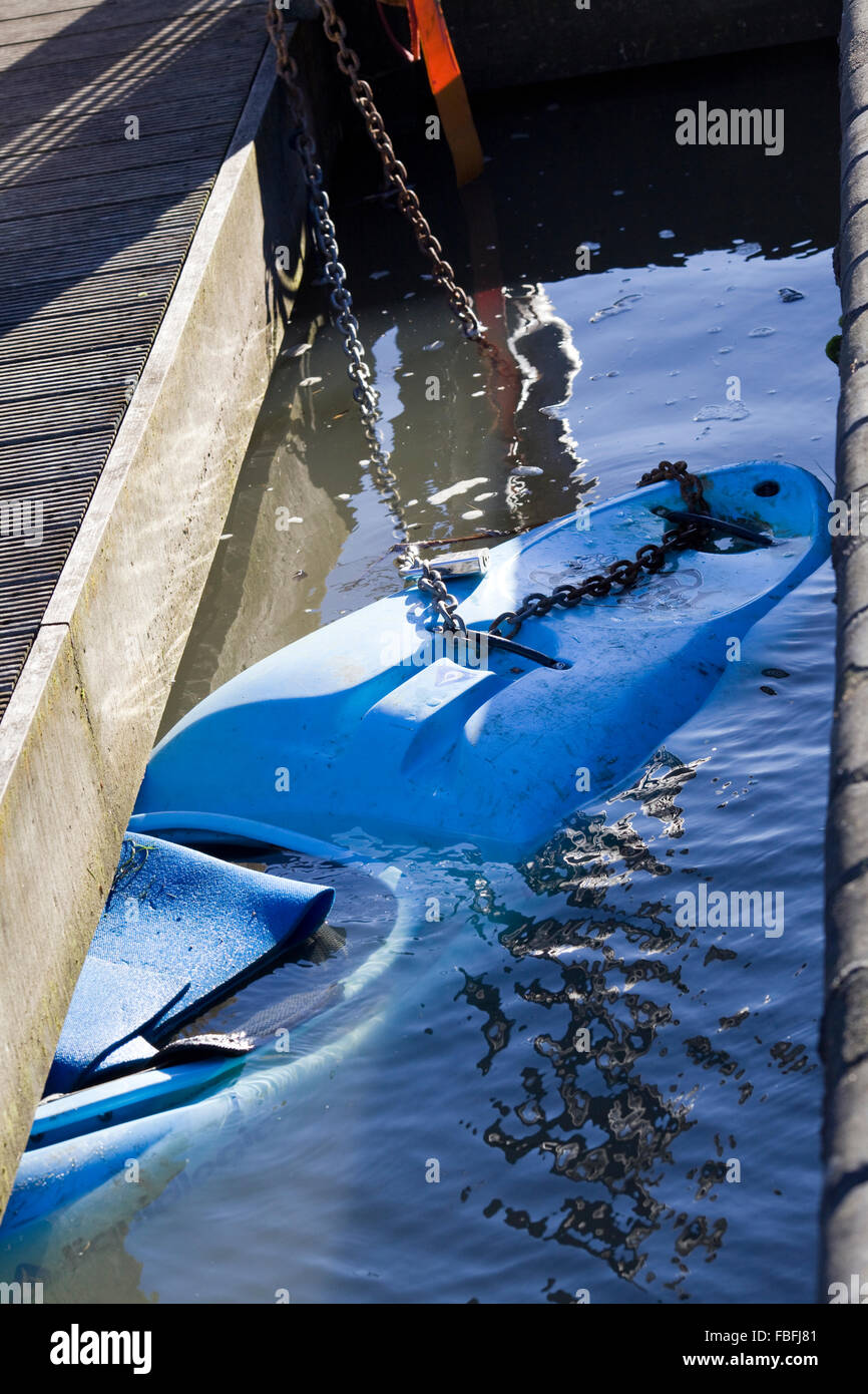 Sunken Kayak under a foot bridge in the floods Stock Photo - Alamy