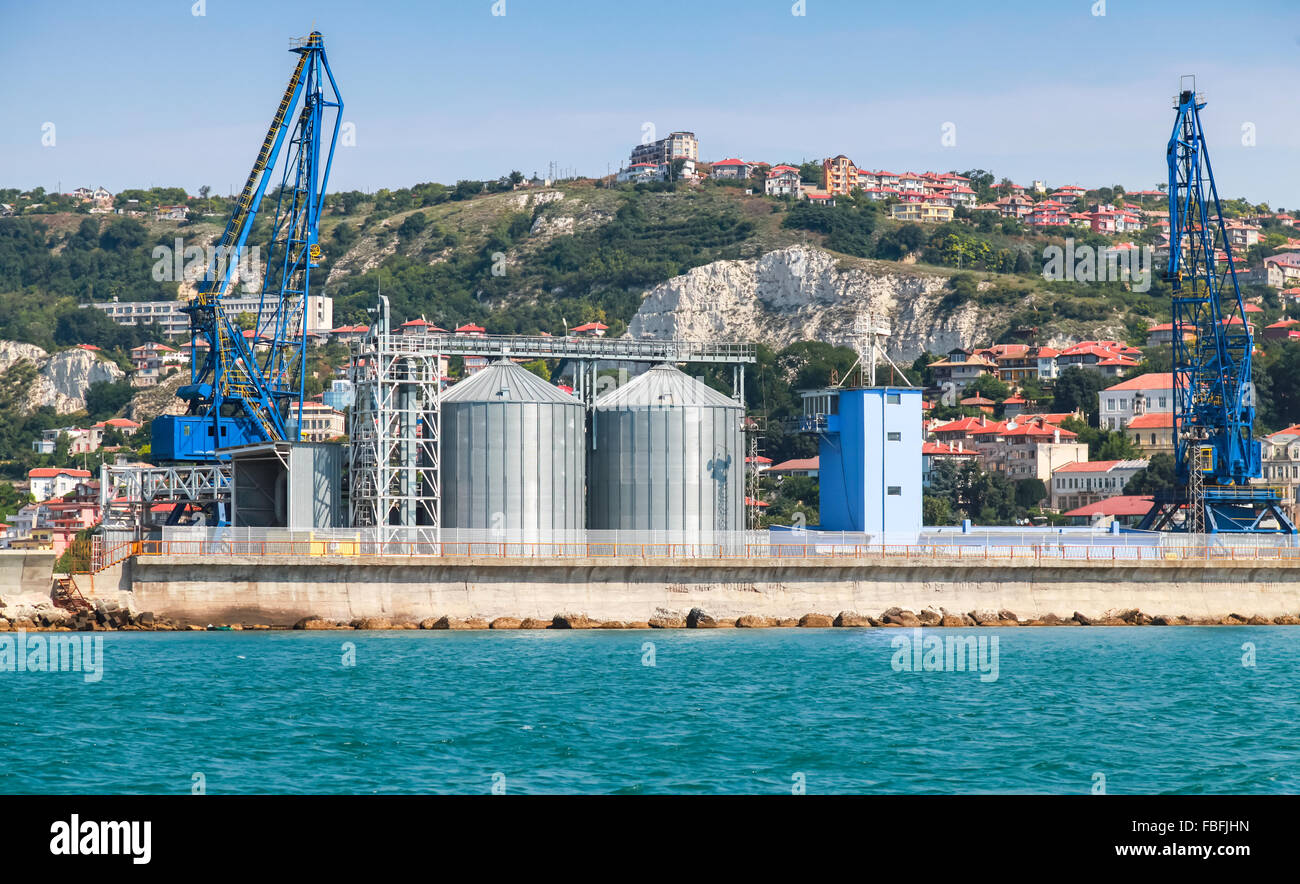 Cranes and tanks in Cargo terminal of Balchik port, Bulgaria. Black Sea ...