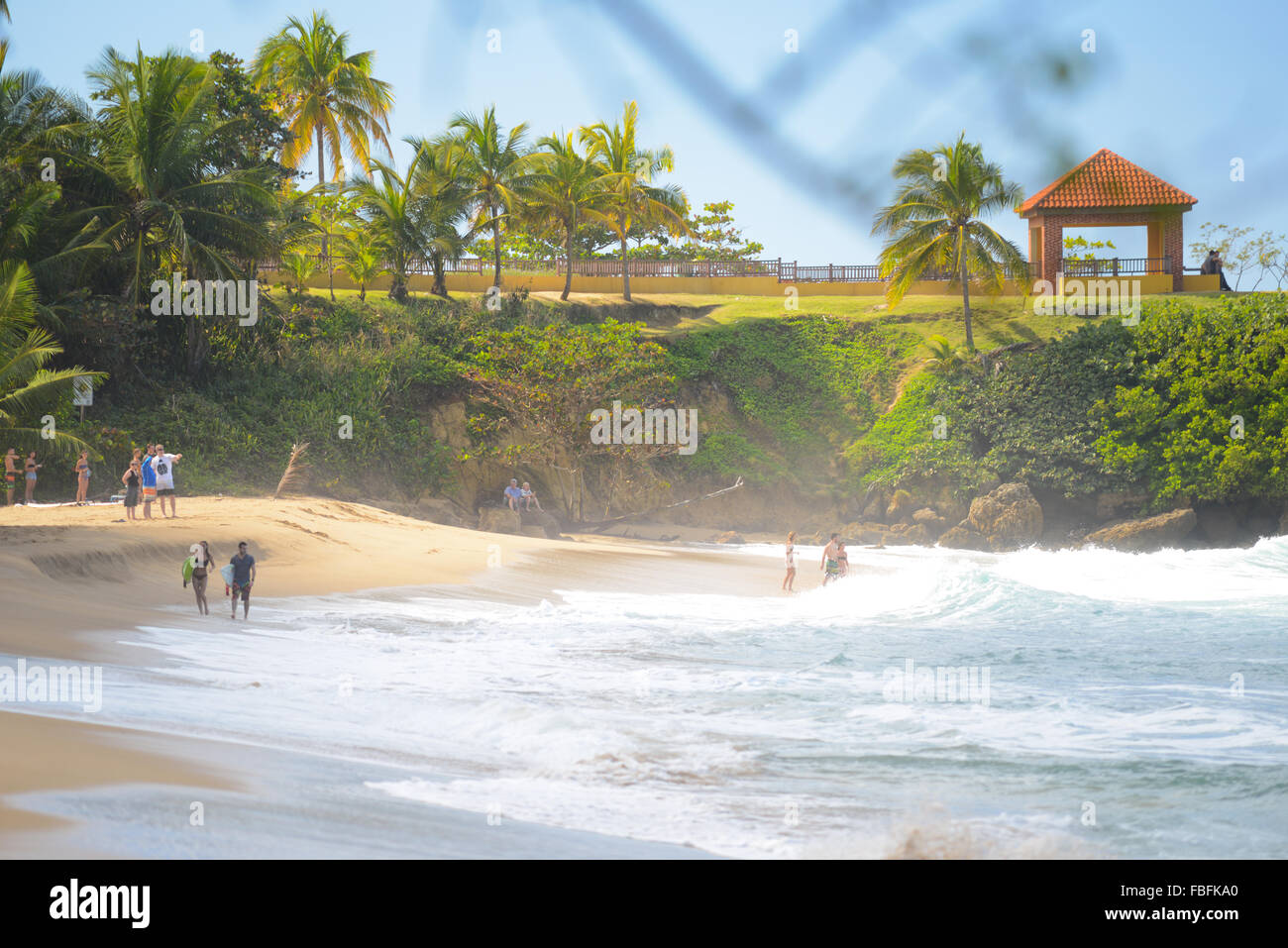 Surfers and tourists at Dome's Beach. Rincon, Puerto Rico. USA ...
