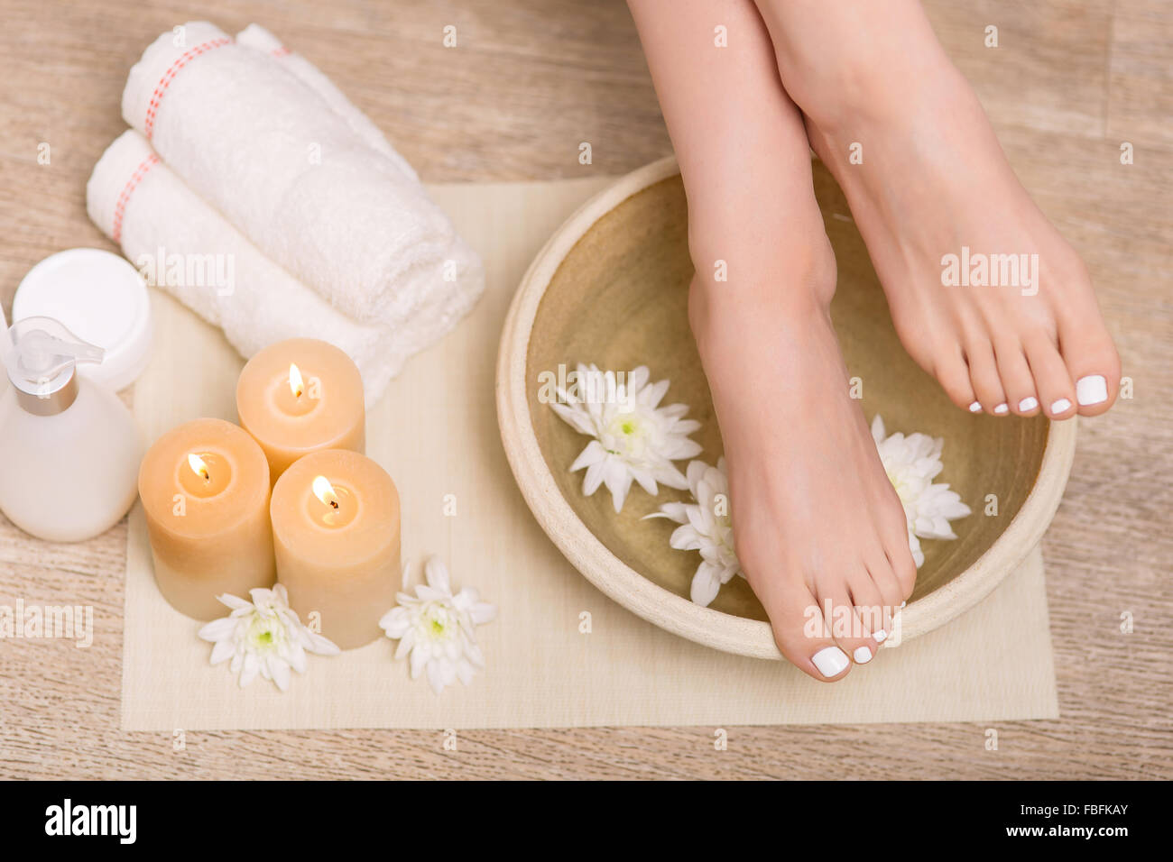 Nice woman taking care of her legs Stock Photo - Alamy