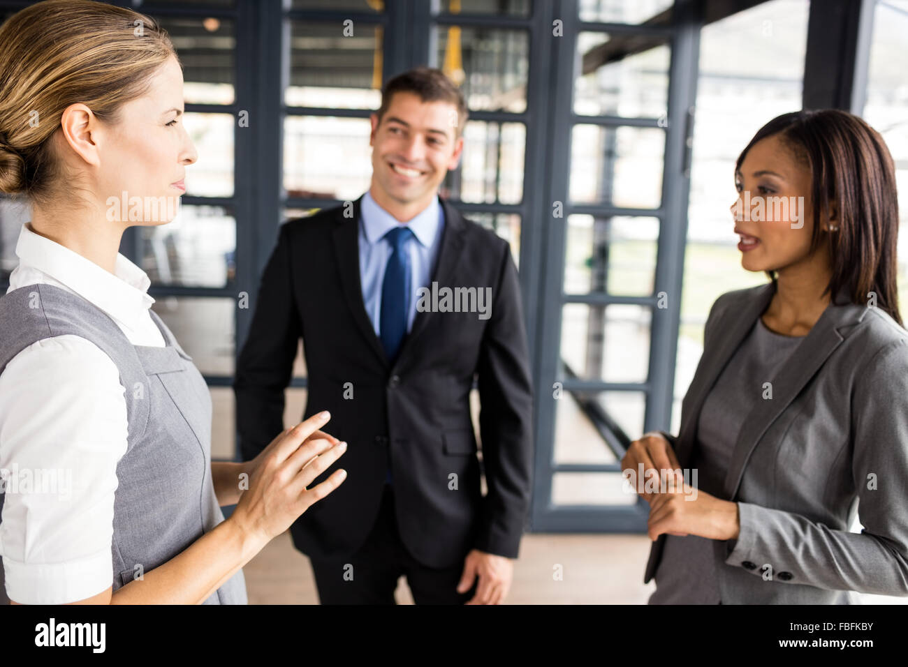 Serious business people talking together Stock Photo - Alamy